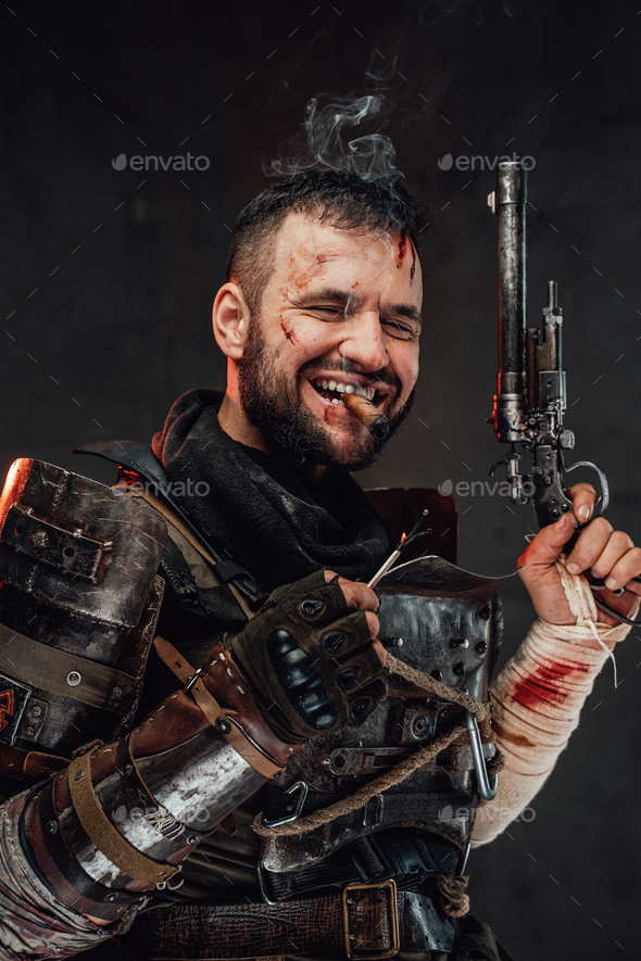 Joyful survival soldier with pistol smoking cigar in dark background ...