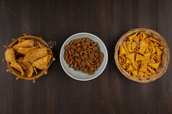 top view of crispy tasty rye rusks on a bowl with spicy chips on a ...