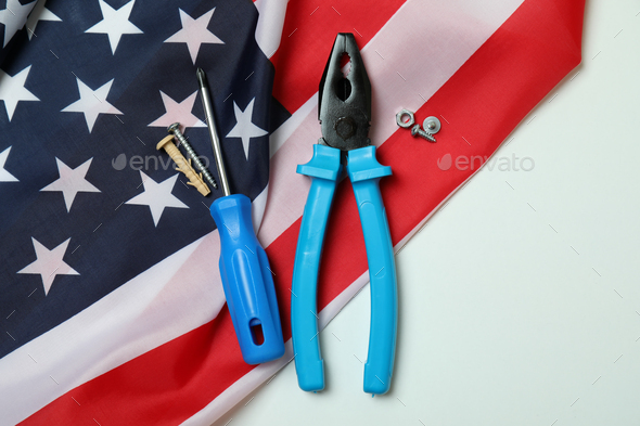 American flag and tools on white background Stock Photo by AtlasComposer