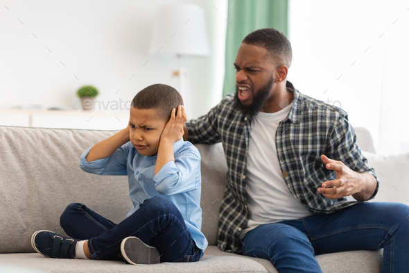 Aggressive Black Father Shouting At Unhappy Kid Boy At Home Stock Photo ...