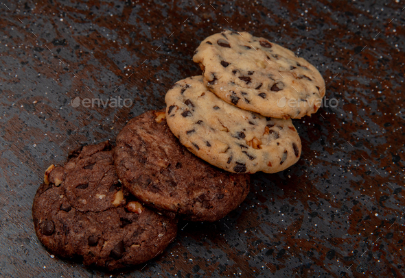 side view of cookies on black and maroon background Stock Photo by ...