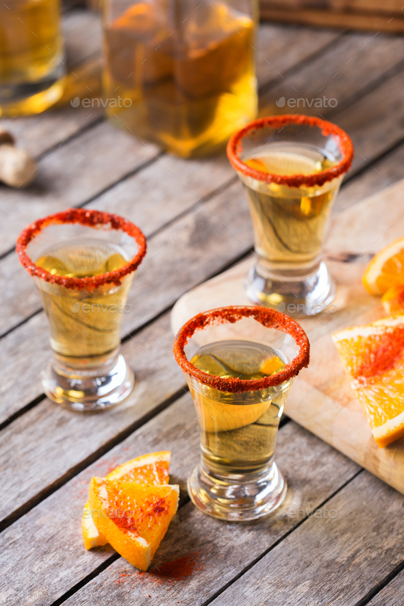 Mexican mezcal or mescal shot with chili pepper and orange Stock Photo ...