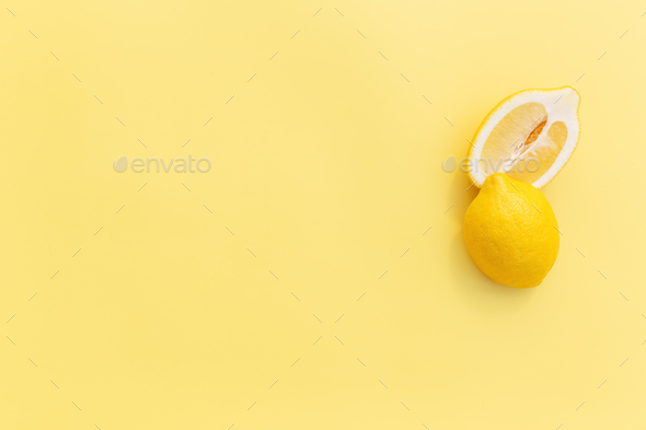 Two halved cuts of lemon with shadow on yellow background Stock Photo ...