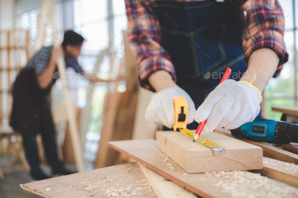 professional carpenter team work in construction with wood workshop ...