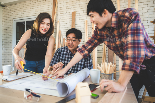 professional carpenter team work in construction with wood workshop ...