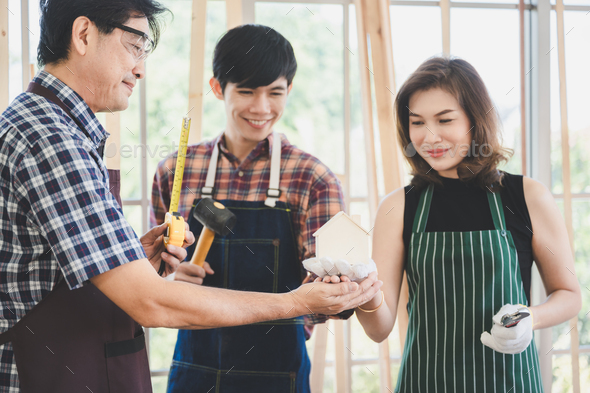 professional carpenter team work in construction with wood workshop ...