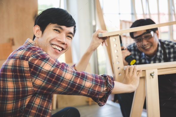 professional carpenter team work in construction with wood workshop ...