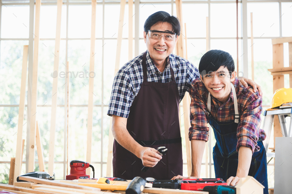 professional carpenter team work in construction with wood workshop ...