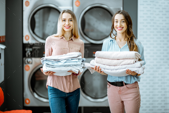 Women with clean clothes in the laundry Stock Photo by RossHelen ...
