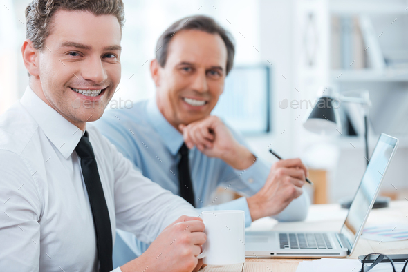 Business partners at work. Stock Photo by gstockstudio | PhotoDune