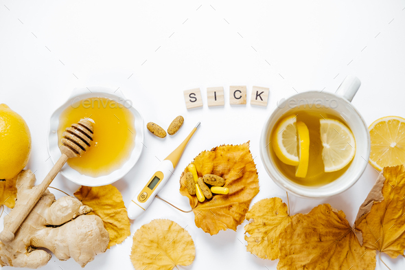 Wooden word sick, Tea with lemon, thermometer, ginger, honey Stock ...