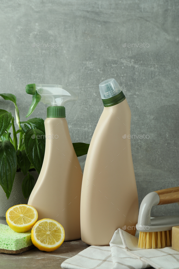 Cleaning concept with eco friendly cleaning tools on gray textured ...