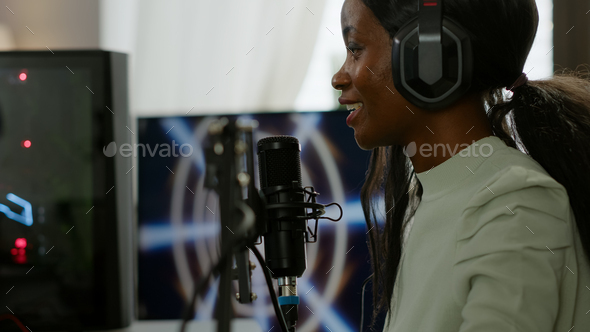 African american esport streamer talking into micrphone Stock Photo by ...