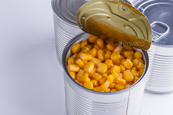 Canned corn in a iron can on white background Stock Photo by wolfhound9111