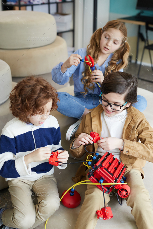 Children Playing with Robot Machine Indoors Stock Photo by ...