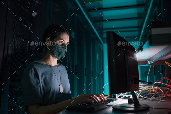 Network Engineer Wearing Mask in Data Center Side View Stock Photo by ...
