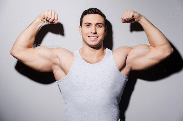 Showing his perfect muscles. Stock Photo by gstockstudio | PhotoDune