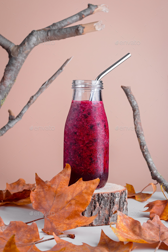 Immune boosting red berries smoothie in glass bottle Stock Photo by Beo88