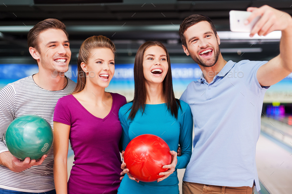 Taking photo before starting the game. Stock Photo by gstockstudio