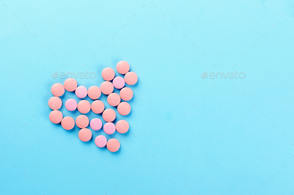 treatment and prevention of heart disease concept, heart shaped pills ...
