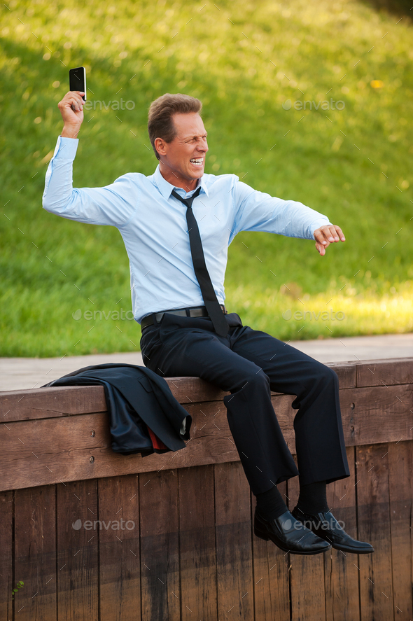 Throwing his mobile phone away. Stock Photo by gstockstudio | PhotoDune