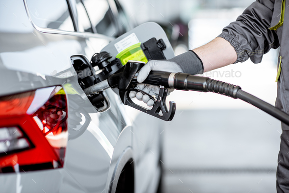 Refueling car with gasoline Stock Photo by RossHelen | PhotoDune