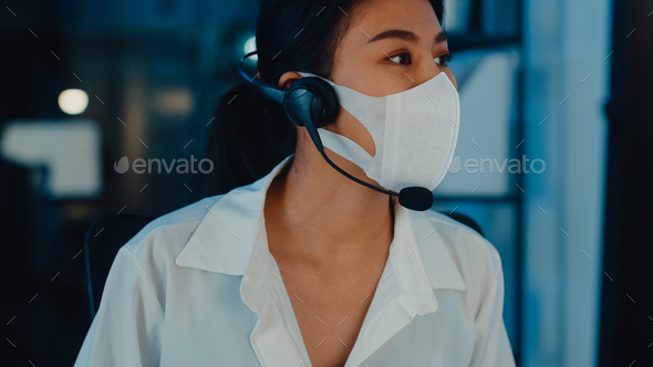 Asia young call center team wearing face mask prevent covid-19 using ...