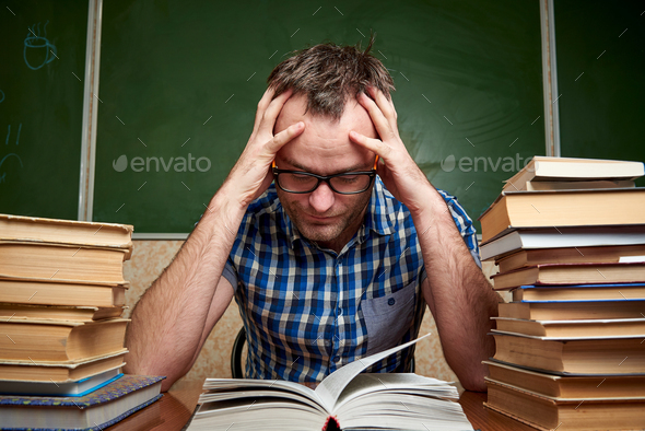 Confused student learning in classroom Stock Photo by viktoriian ...