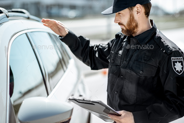 Policeman knocking at the car window Stock Photo by RossHelen | PhotoDune