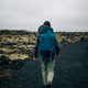 Adventure man walk in icelandic landscape alone Stock Photo by bublikhaus