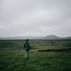 Adventure man walk in icelandic landscape alone Stock Photo by bublikhaus