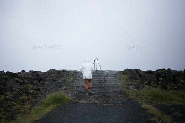 Adventure man walk in icelandic landscape alone Stock Photo by bublikhaus