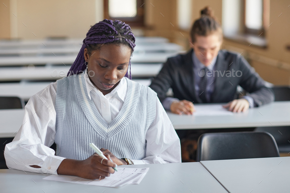 Students wearing uniform in class Stock Photo by seventyfourimages