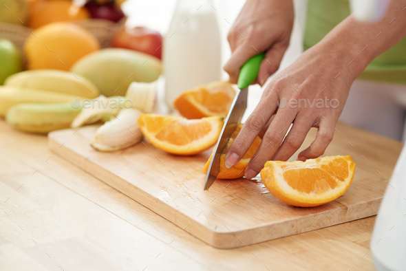 Cutting fruits Stock Photo by DragonImages | PhotoDune