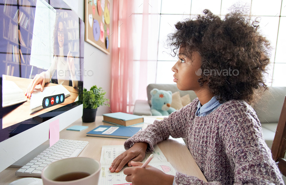 African school kid girl online learning with remote teacher at home on ...
