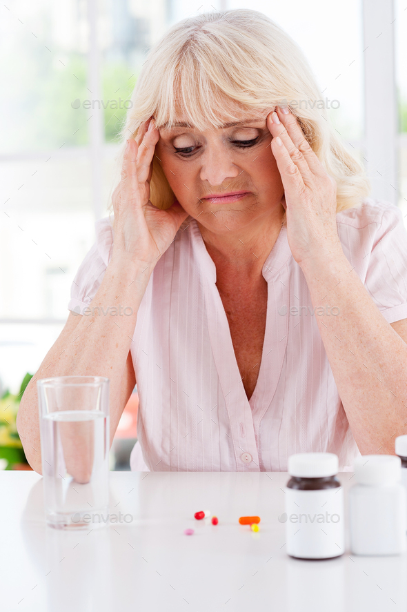 Feeling headache. Stock Photo by gstockstudio | PhotoDune