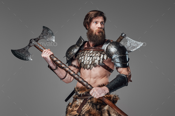 Stationary muscular viking with double axe and hatchet on his back ...