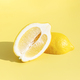 Two halved cuts of lemon with shadow on yellow background Stock Photo ...