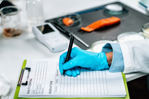 Food Safety and Quality Management. Inspector Filling Out Quality ...