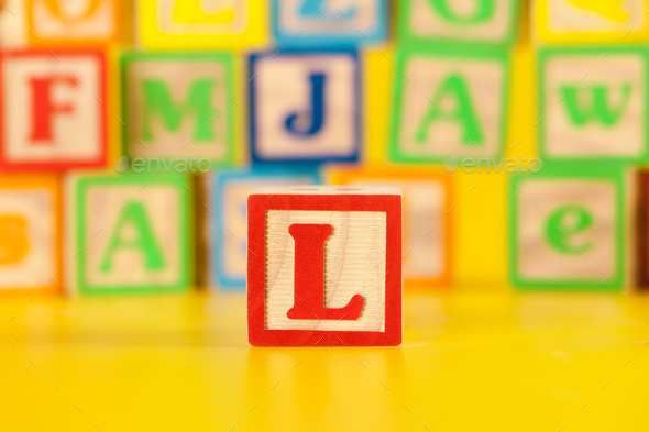 Photograph of colorful Wooden Block Letter L Stock Photo by FabrikaPhoto