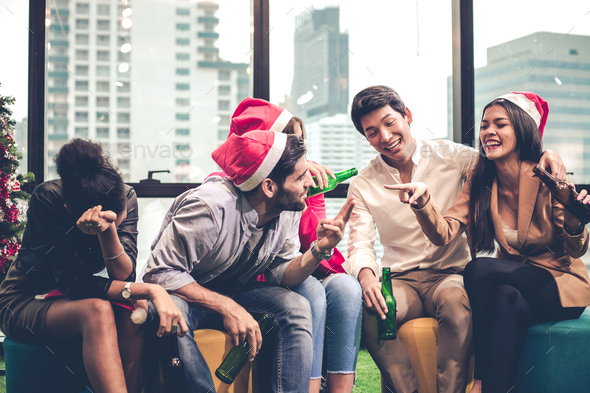 Group of office workers celebrating party with drink beer and funny ...