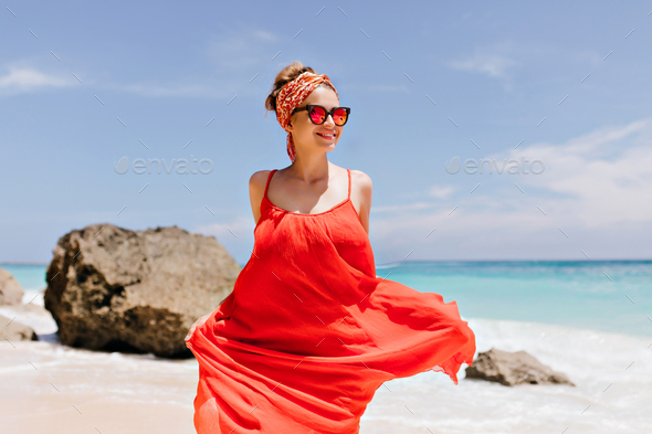 Laughing white girl fooling around at beach in sunny weekend. Outdoor ...