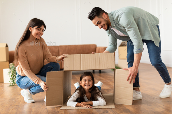 Happy loving young family celebrating relocation together Stock Photo ...