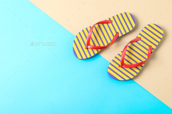 Flip flops on two tone background, space for text and top view. Summer ...