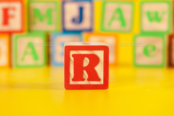 Photograph of colorful Wooden Block Letter R Stock Photo by FabrikaPhoto