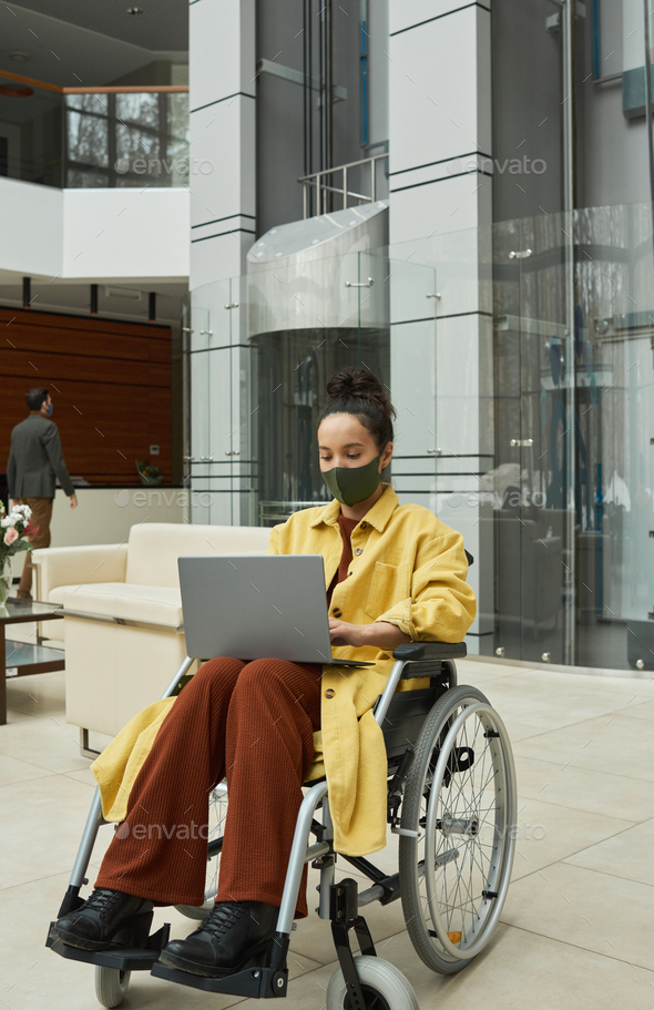 Disabled woman working on laptop Stock Photo by AnnaStills | PhotoDune