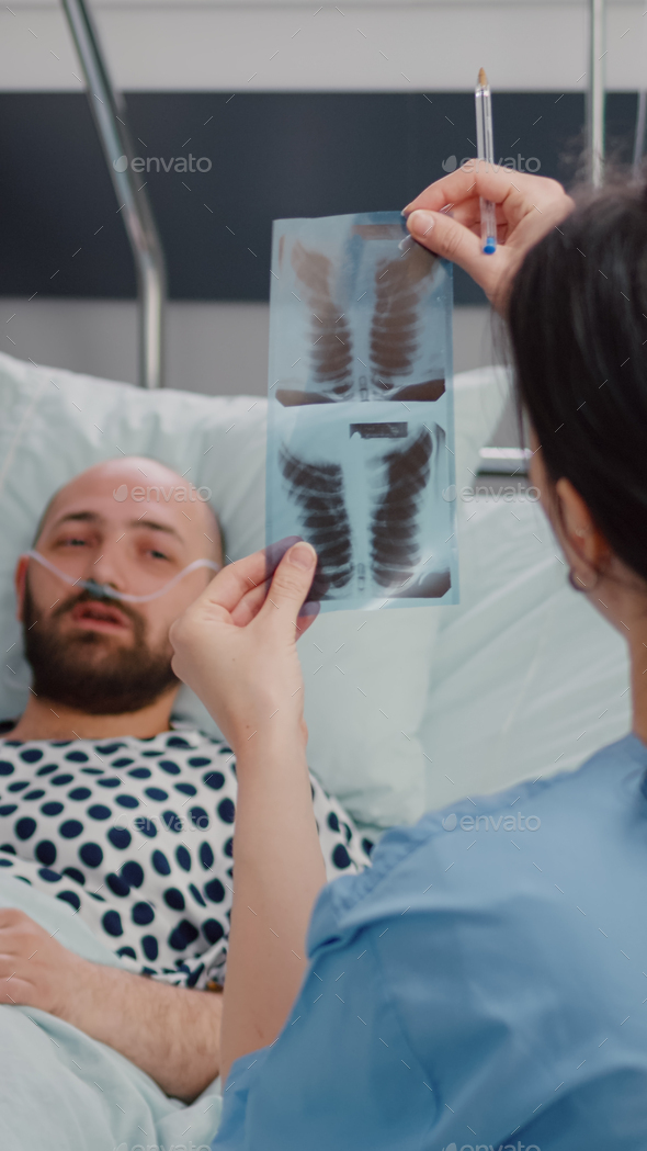 Closeup of woman nurse showing bones radiography monitoring sickness ...