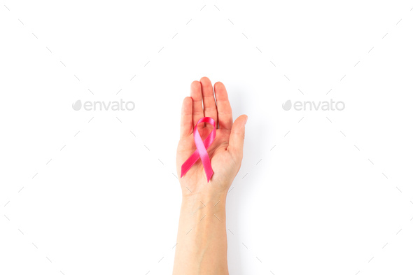 Female hand with pink awareness ribbon isolated on white background ...