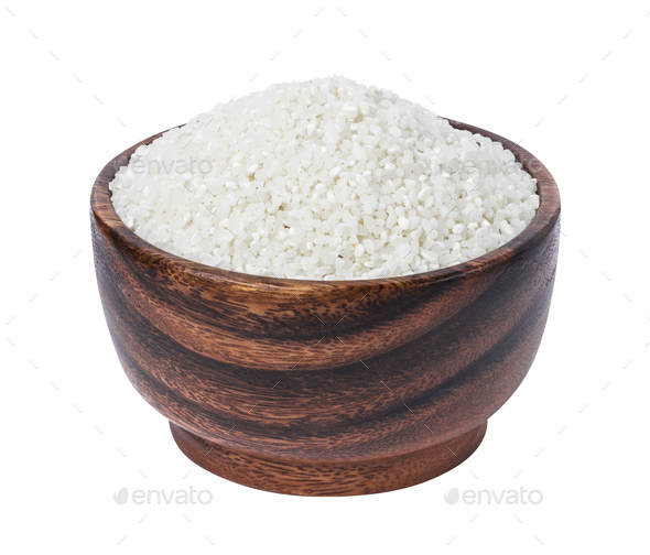 Small crushed rice in wooden bowl isolated on white background Stock ...