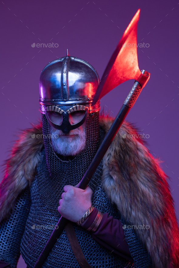 Elder violent knight with axe dressed in chain mail Stock Photo by fxquadro